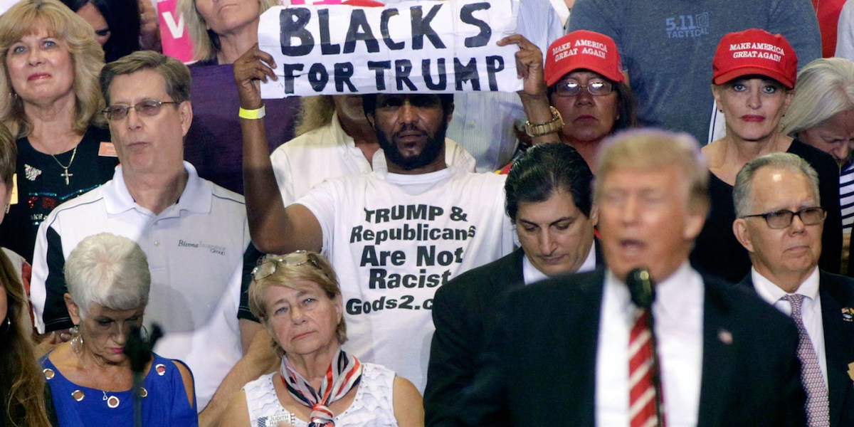 Man Waving "Blacks for Trump" Sign Warns of Race War